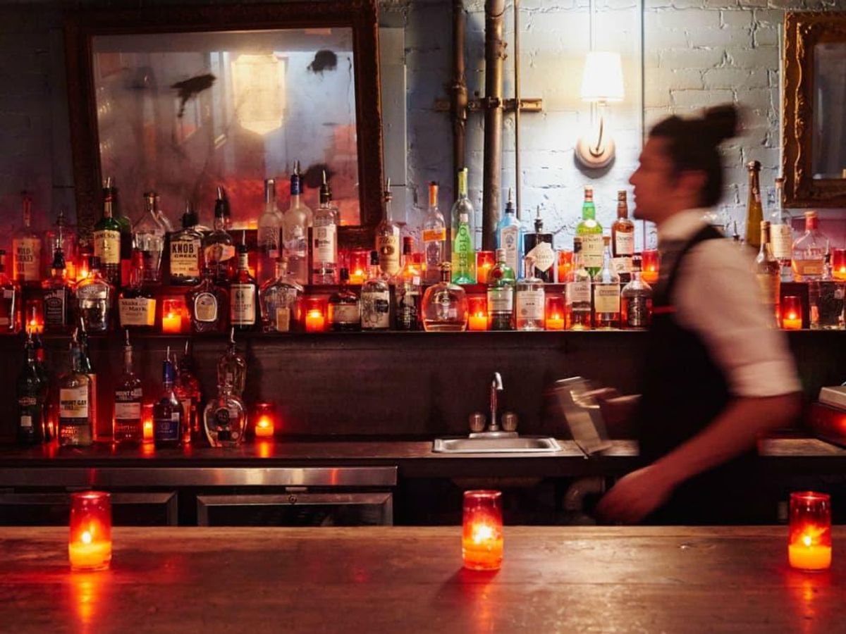 Candles cast a warm glow on the Havana Bar. - CultureMap San Antonio