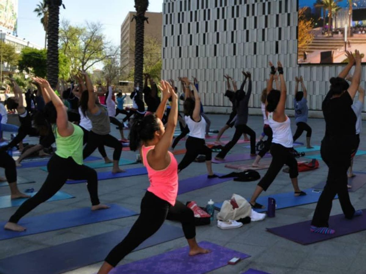 Start your Saturday with a free yoga class on the Tobin Center Plaza ...