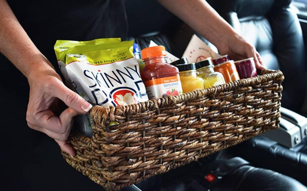 On-board attendants offer guests a complimentary selection of snacks ...